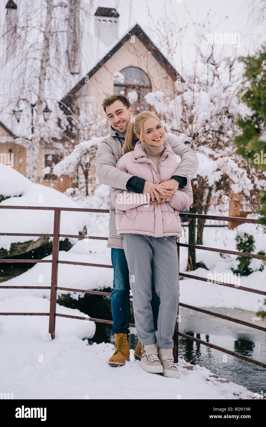 happy man hugging blonde attractive girlfriend in winter Stock Photo ...