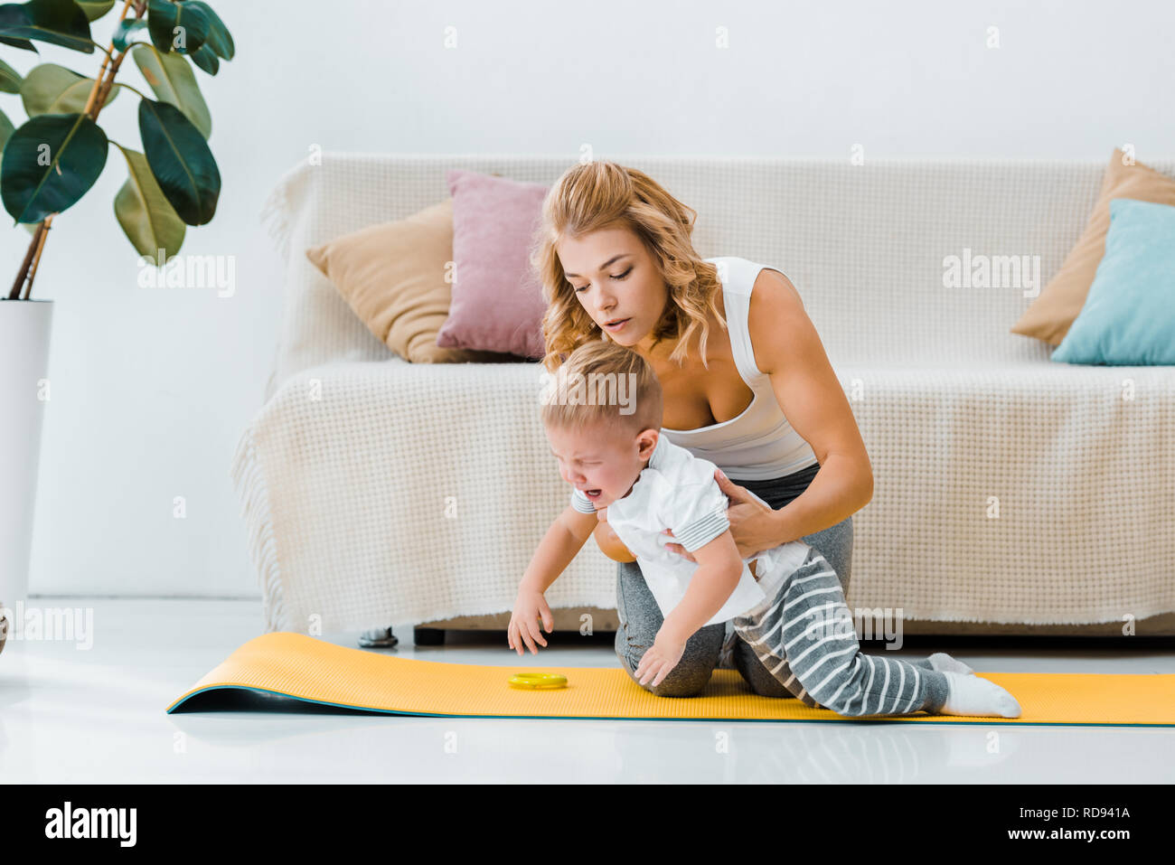 Woman holding toy and crying hi-res stock photography and images - Alamy