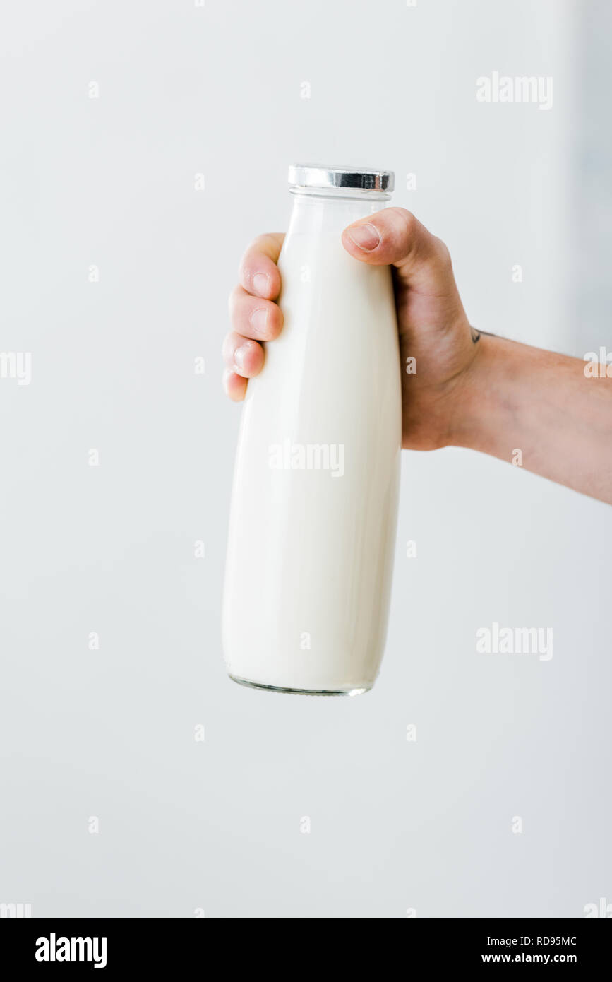 Holding milk bottle hi-res stock photography and images - Alamy