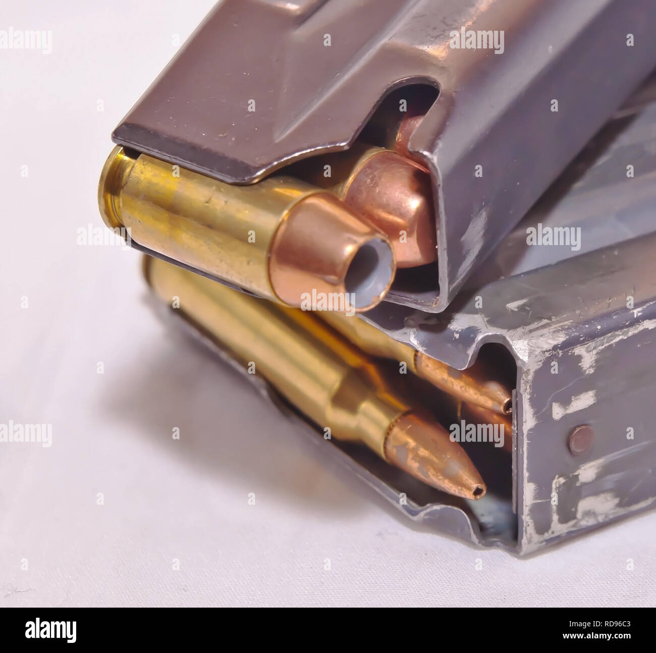 A handgun magazine loaded with .40 caliber hollow point bullets on top ...