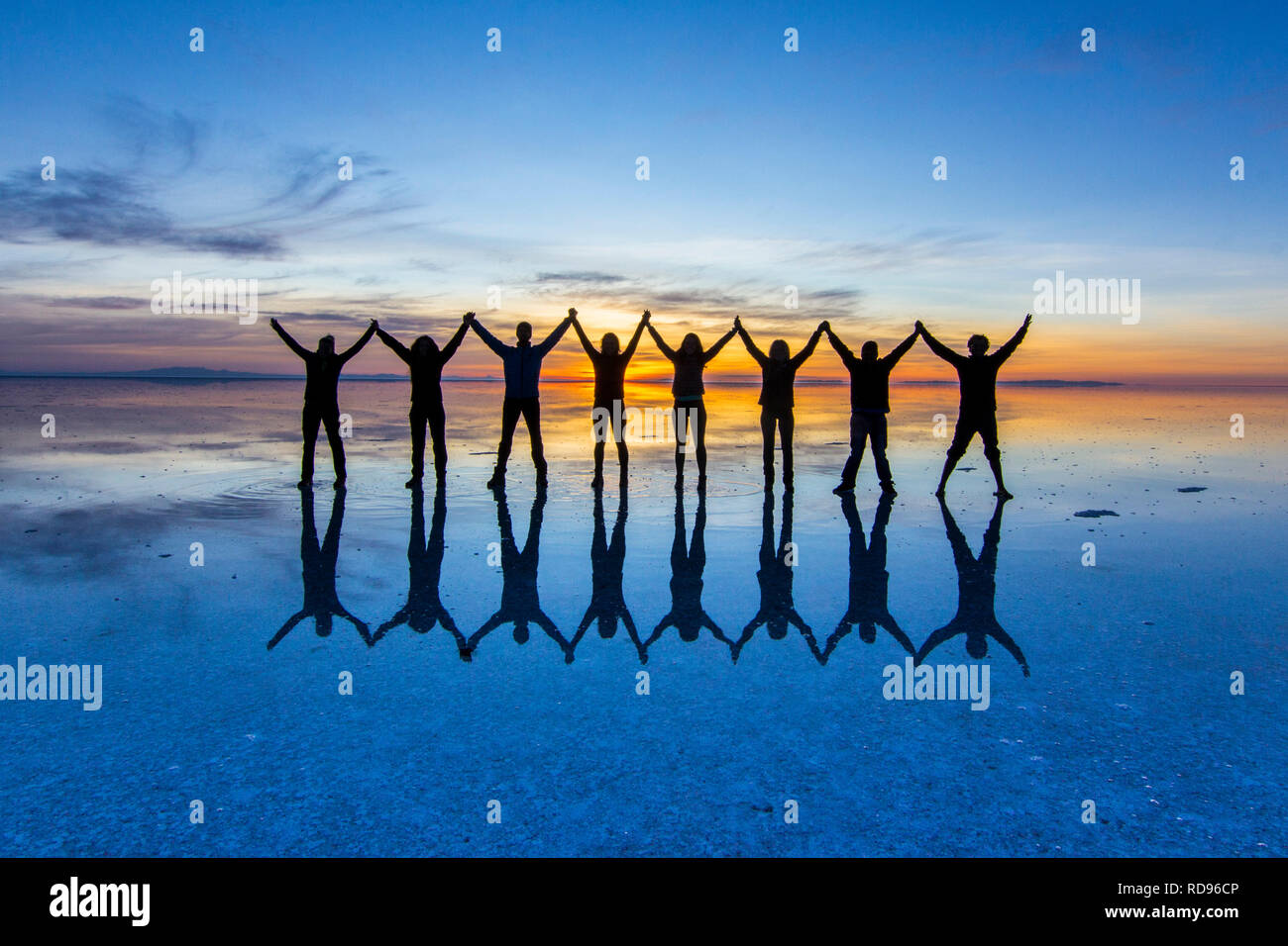 Amazing real people reflections in water at Uyuni Saltflats scenery ...