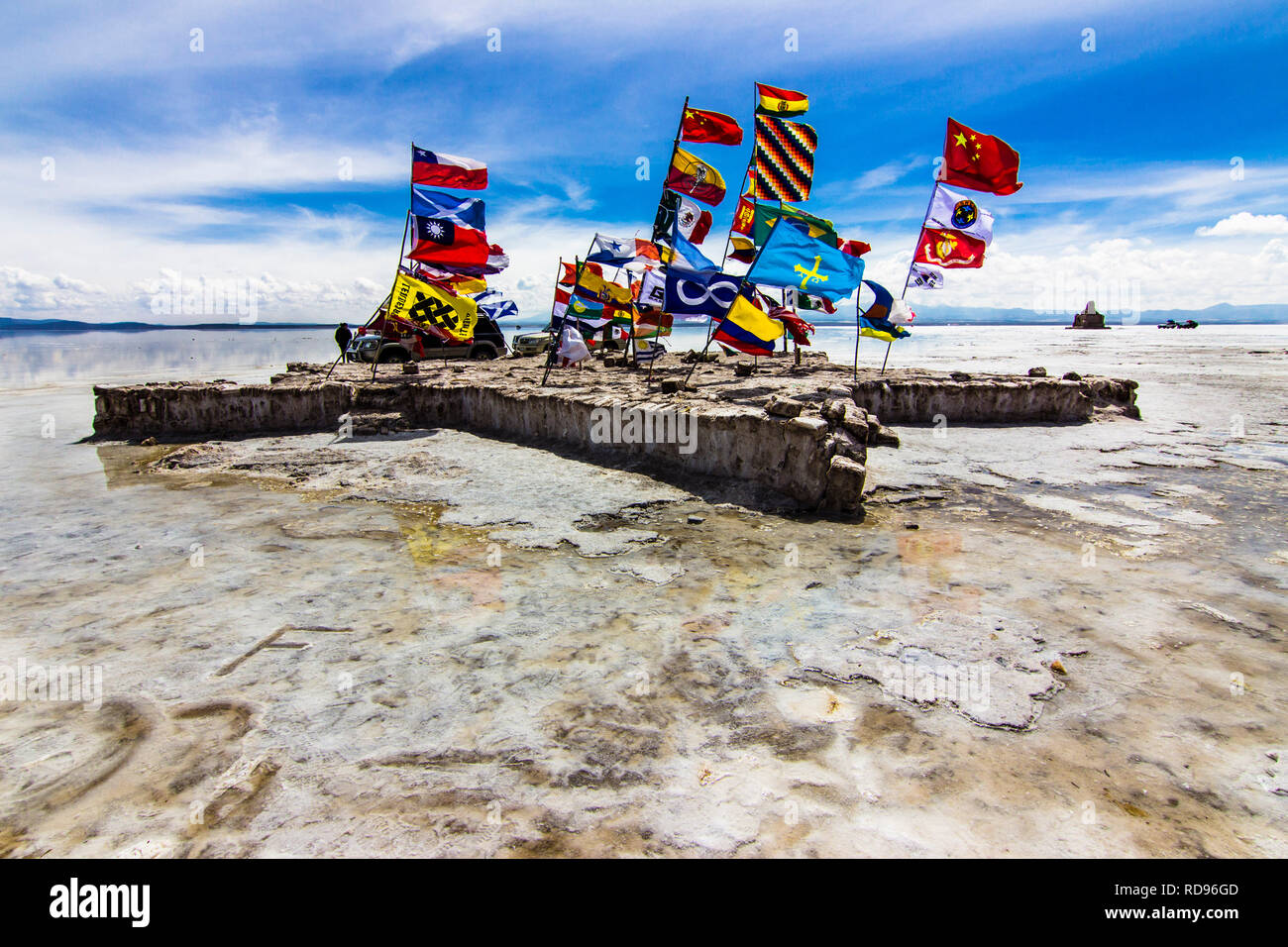 An international point inside Uyuni Saltflats, waving flags from ...