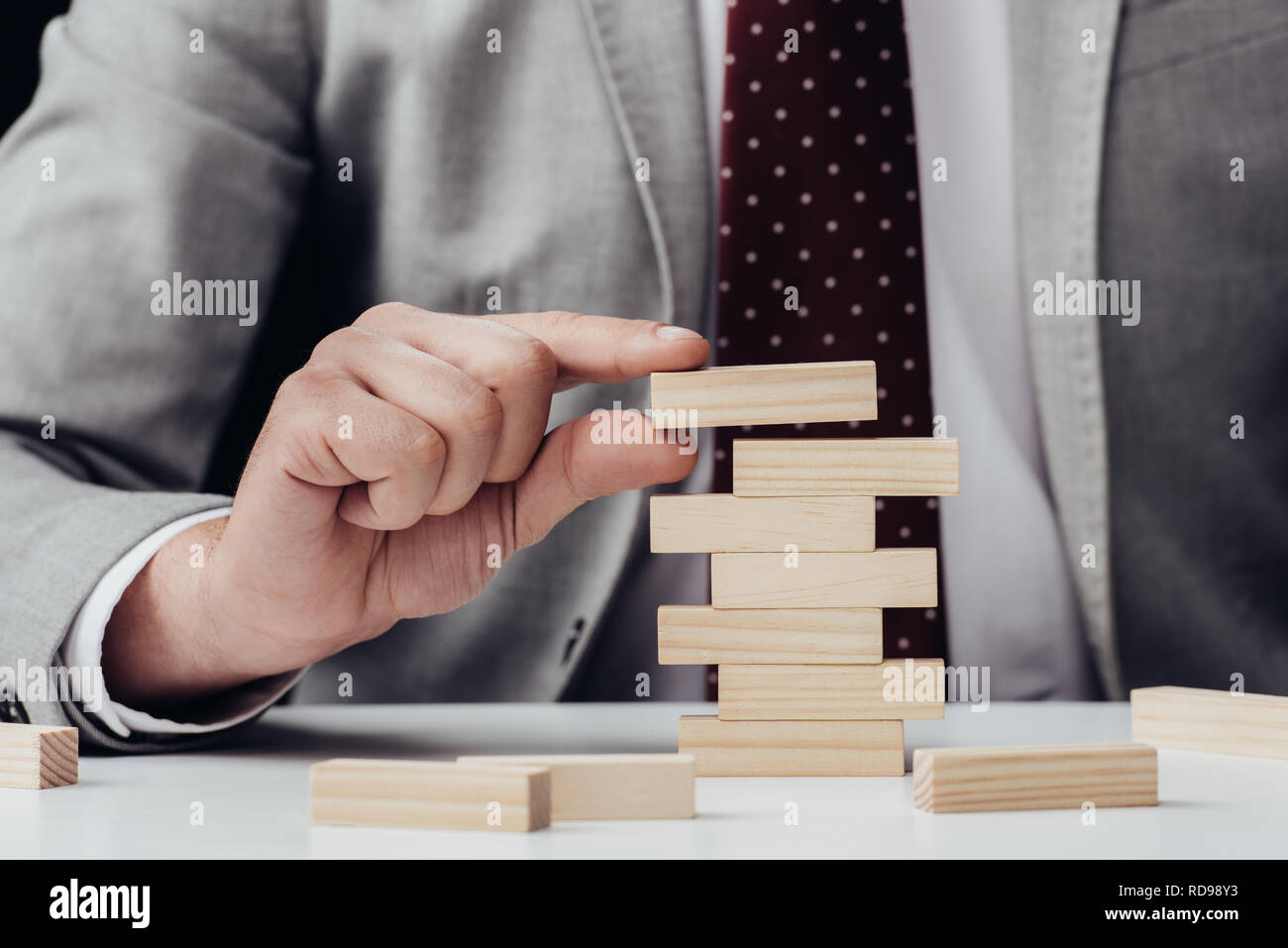 Man putting wooden blocks hi-res stock photography and images - Alamy