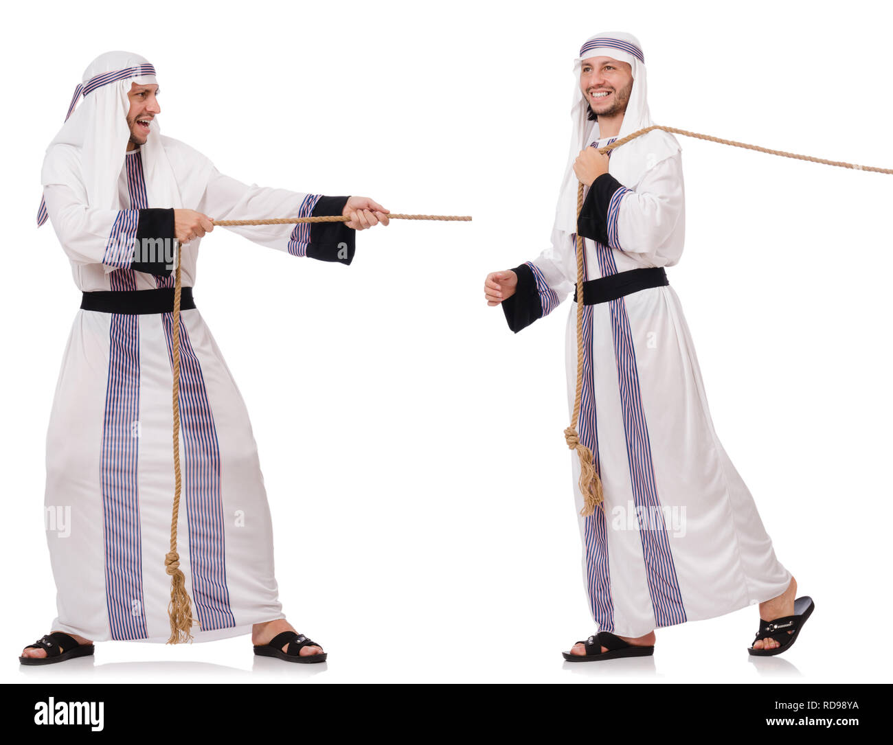 Arab man pulling rope in tug of war concept Stock Photo - Alamy