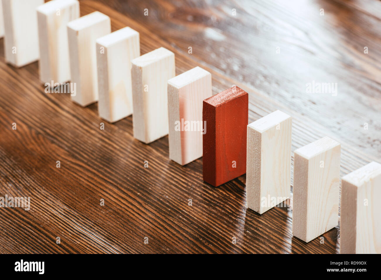 selective focus of wooden block row with red one on desk Stock Photo ...