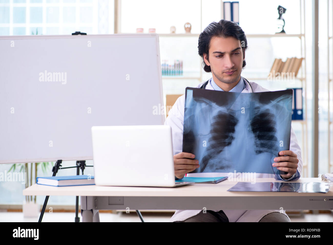 Young handsome male radiologist in front of whiteboard Stock Photo - Alamy