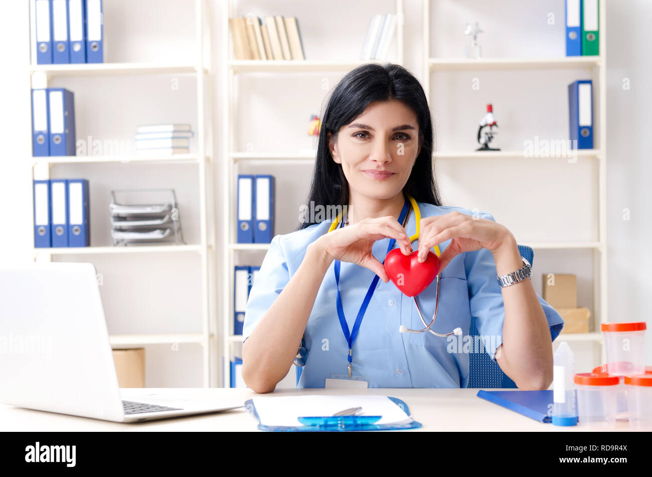 Female doctor cardiologist working in the clinic Stock Photo - Alamy