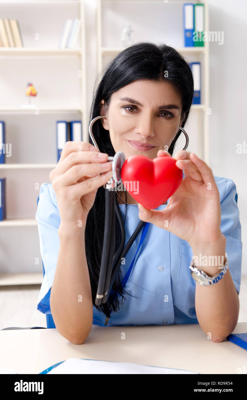 Female doctor cardiologist working in the clinic Stock Photo - Alamy