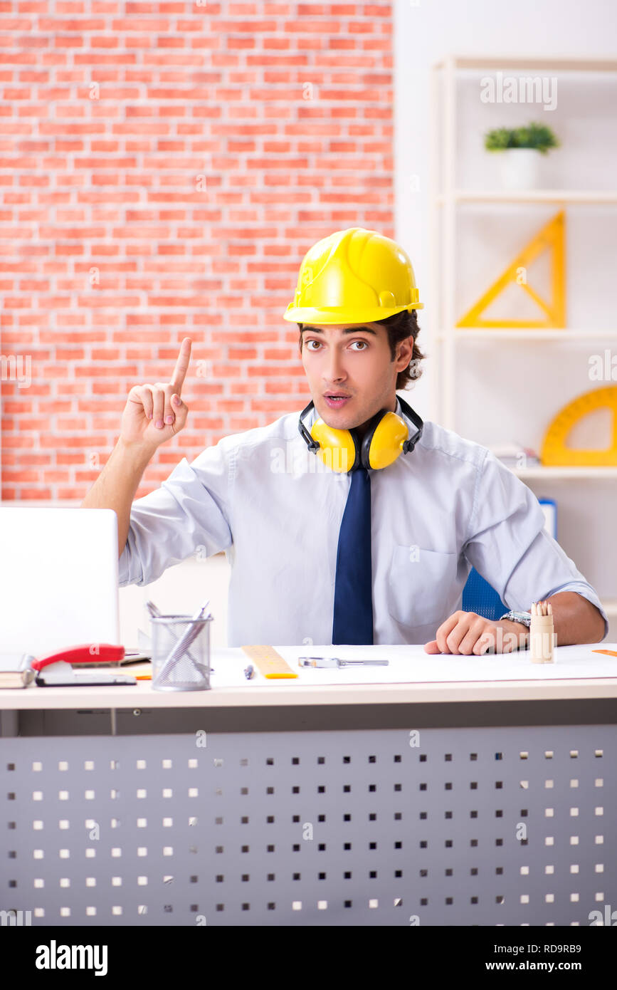 Construction supervisor working on blueprints Stock Photo - Alamy