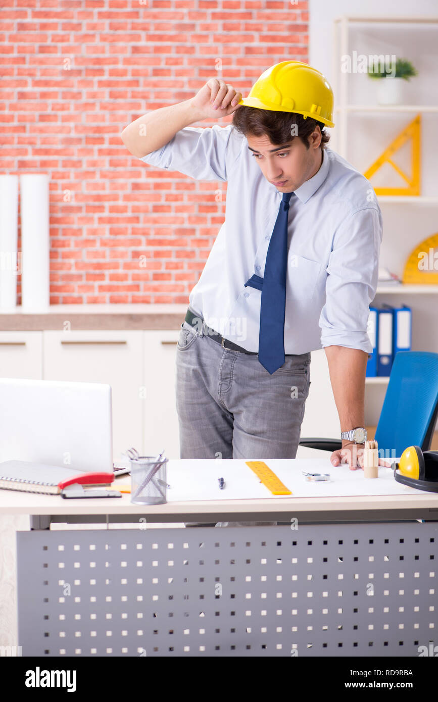 Construction supervisor working on blueprints Stock Photo - Alamy