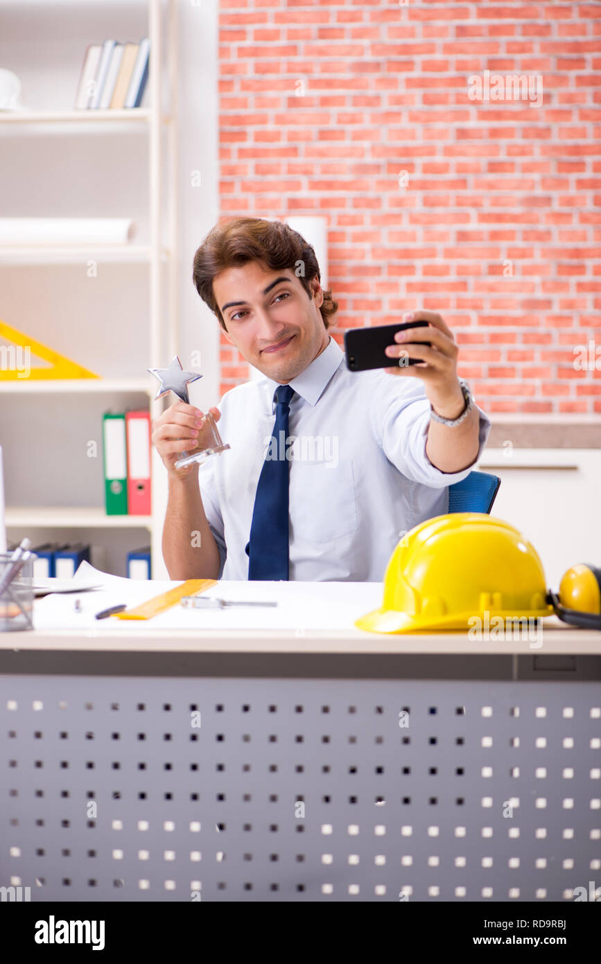 Construction supervisor working on blueprints Stock Photo - Alamy