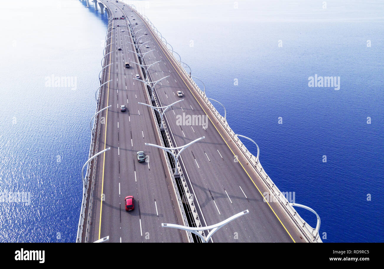 Aerial view of highway in the ocean. Cars crossing bridge interchange ...