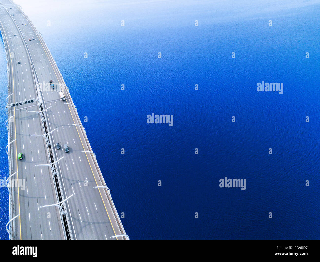 Aerial view of highway in the ocean. Cars crossing bridge interchange ...