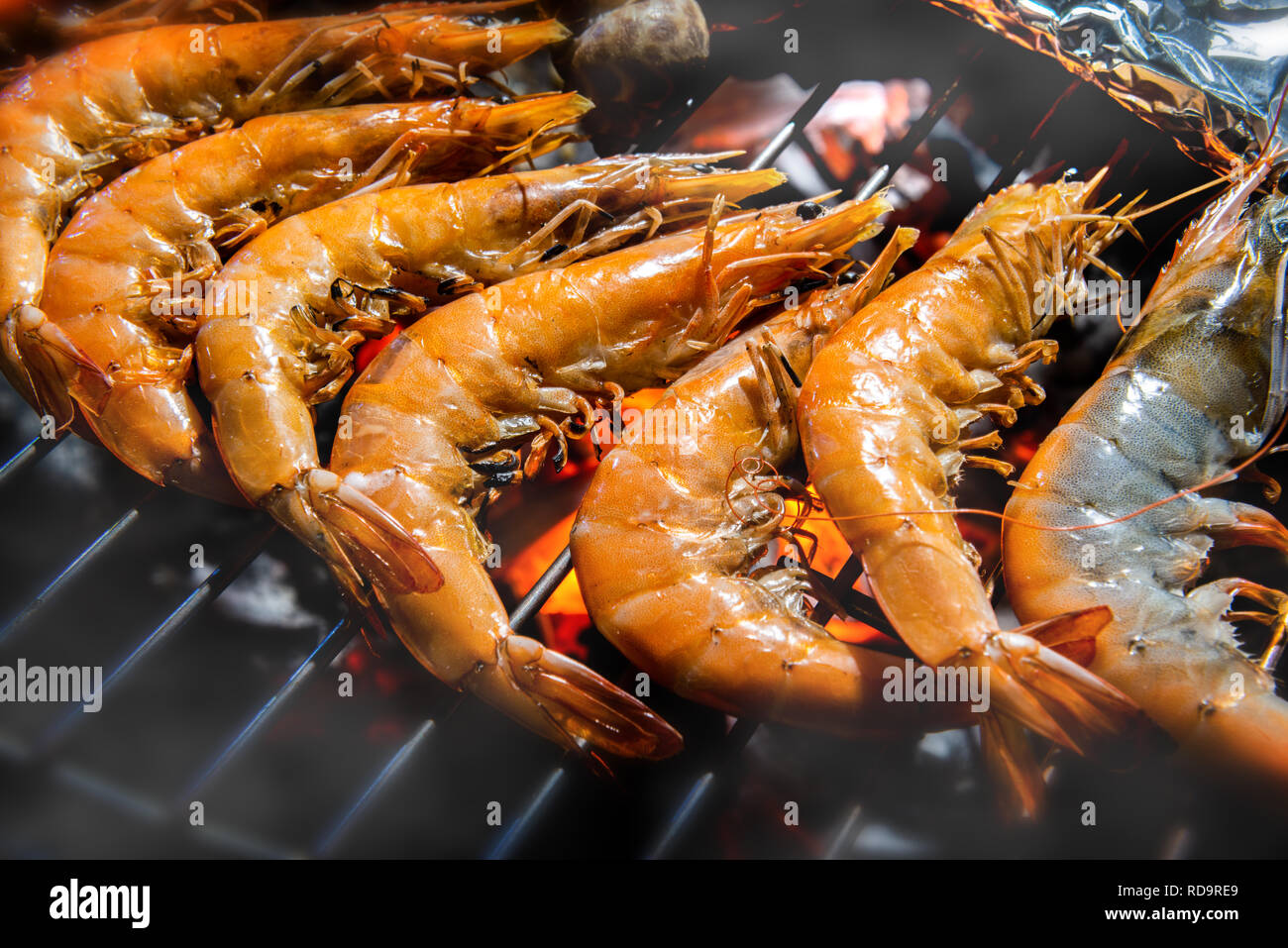 Grilled flame fire seafood and barbecue foods Stock Photo - Alamy