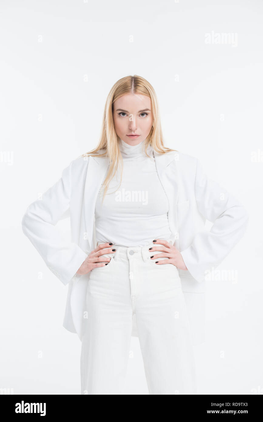 Attractive Caucasian Blonde Woman In Fashionable White Clothes Posing