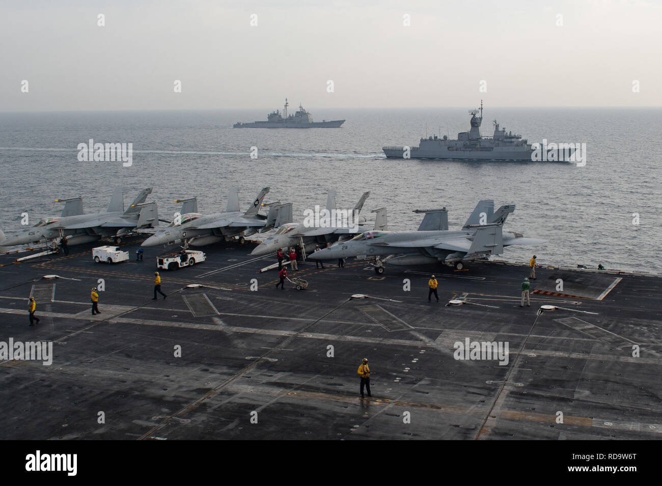 The Royal Australian Navy frigate HMAS Ballarat (FFH 155), right, and ...