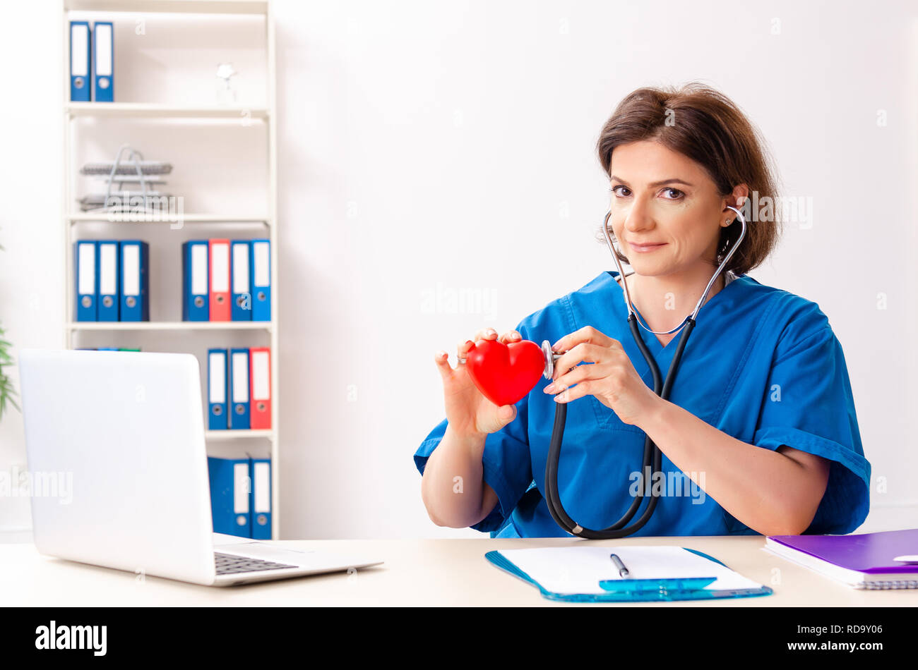 Female doctor cardiologist working in the hospital Stock Photo - Alamy