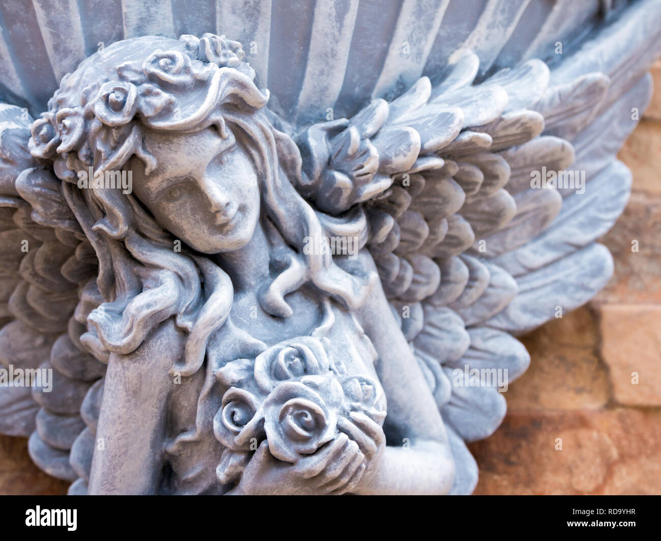 Fairy statue decorated on the stone texture wall Stock Photo - Alamy