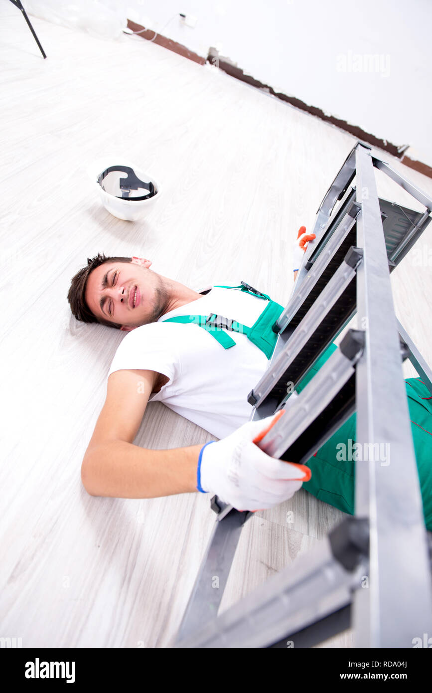 Young worker falling from the ladder Stock Photo - Alamy