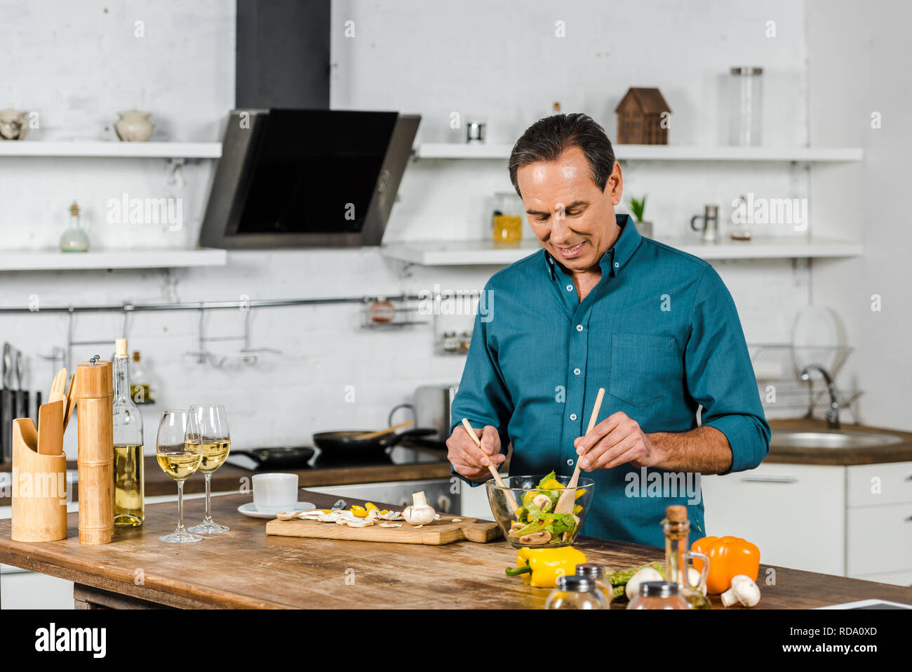 Man cooking in kitchen hi-res stock photography and images - Alamy