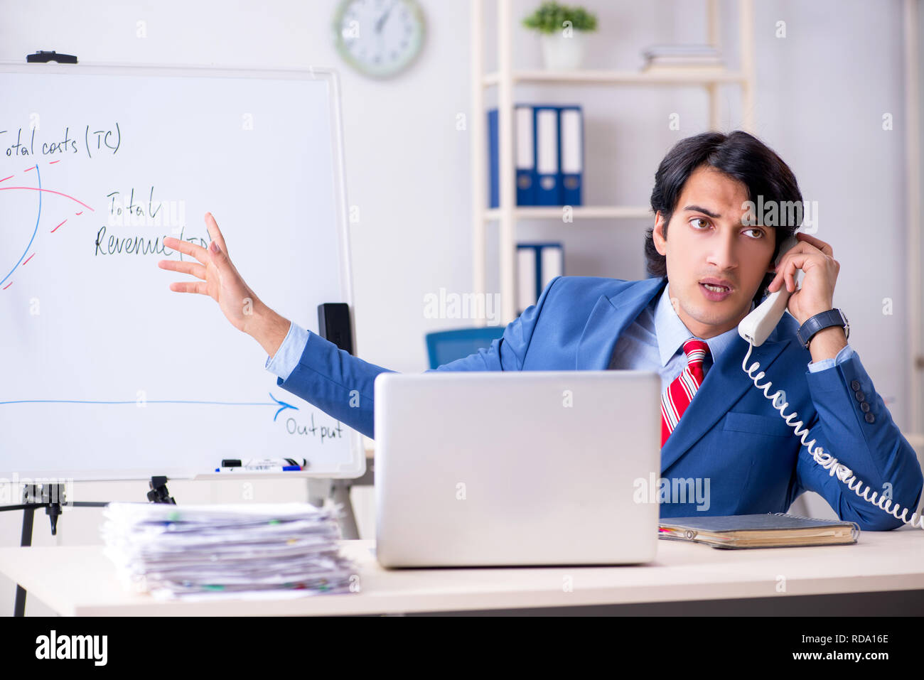 Company employee explaining charts presentation hi-res stock ...