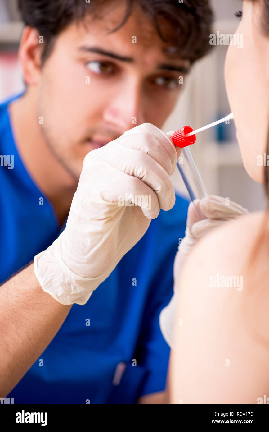 Doctor getting saliva test sample in clinic hospital Stock Photo - Alamy