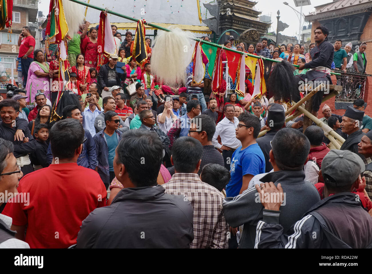 During a neighborhood festival in Kathmandu, Nepal, a man endeavors to ...