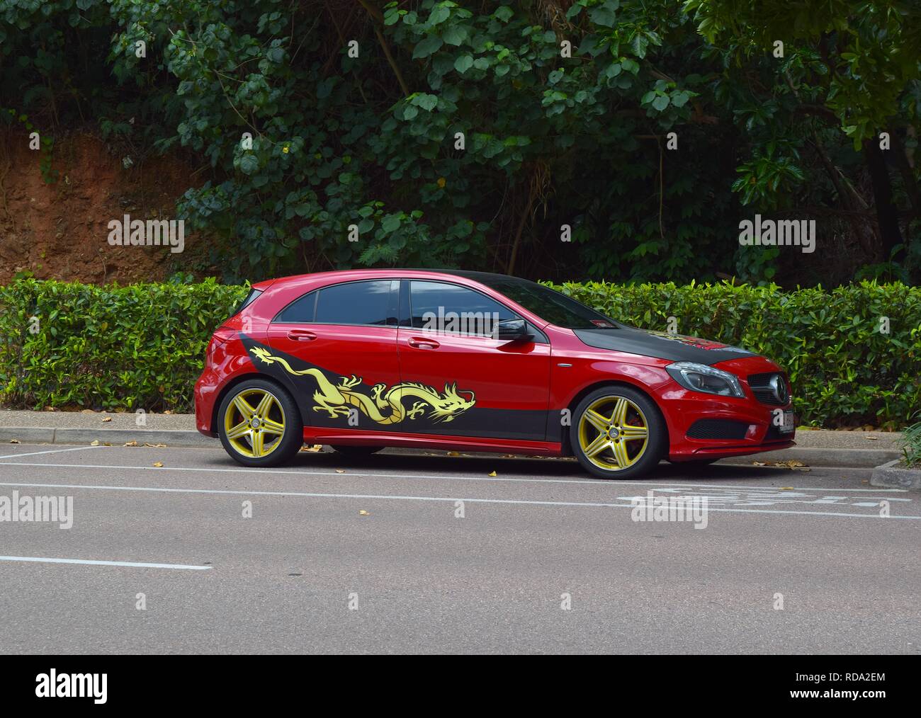 Red car with customised dragon painting Stock Photo - Alamy