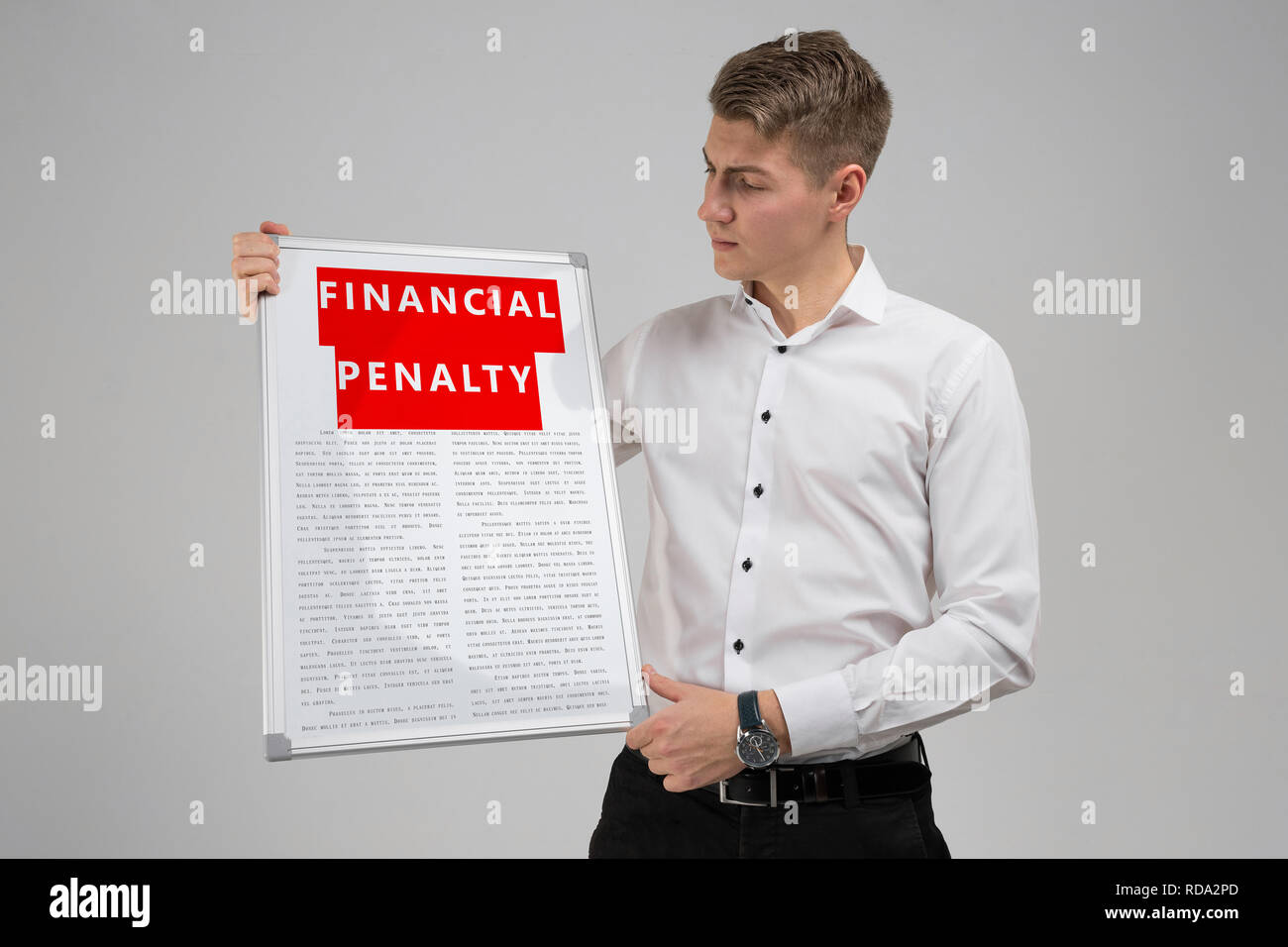 Young man holding a poster with the financial penalty is isolated on a ...