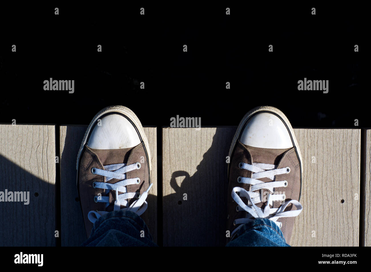 Feet hanging off pier hi-res stock photography and images - Alamy