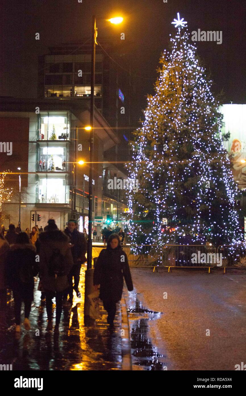 Christmas tree with lights on a rainy night in Deansgate at the bottom ...