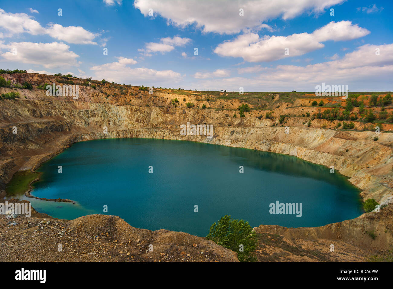 Abandoned cuprum mine in Bulgaria with lake inside Stock Photo - Alamy