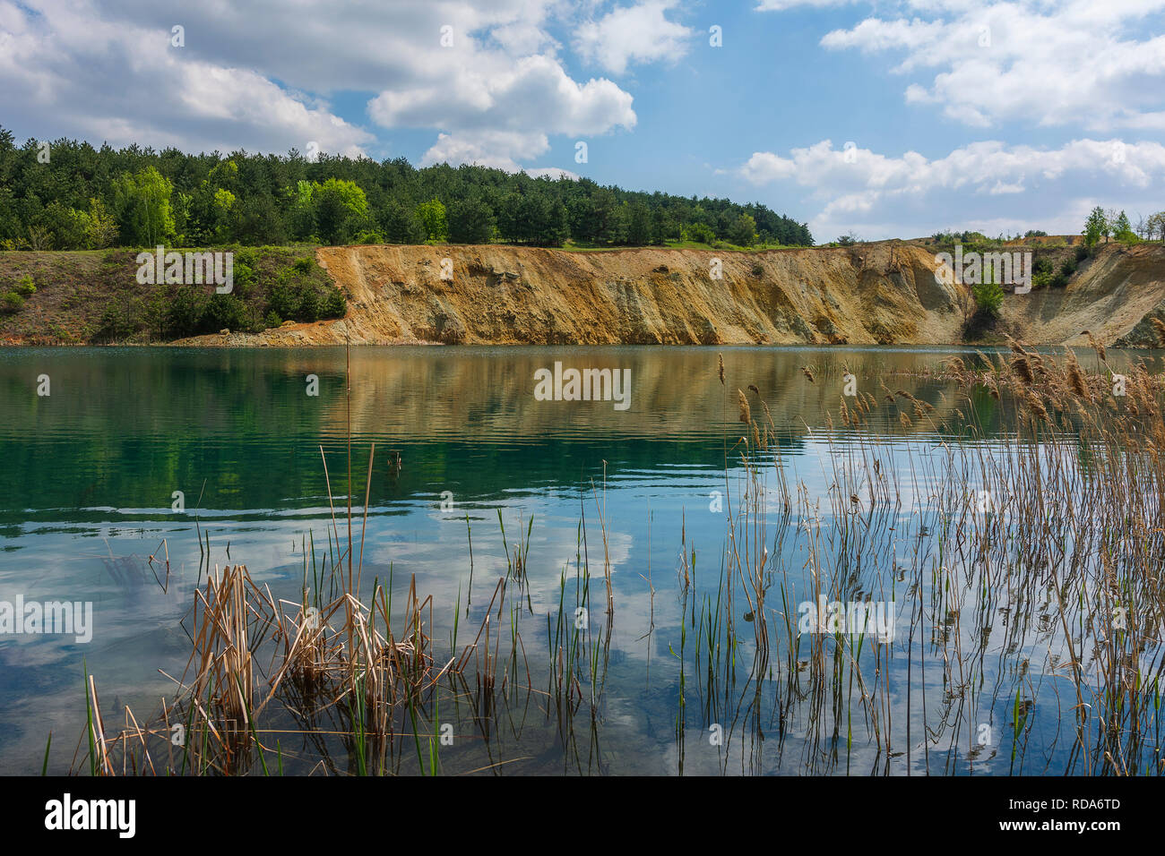 Abandoned cuprum mine in Bulgaria with lake inside Stock Photo - Alamy