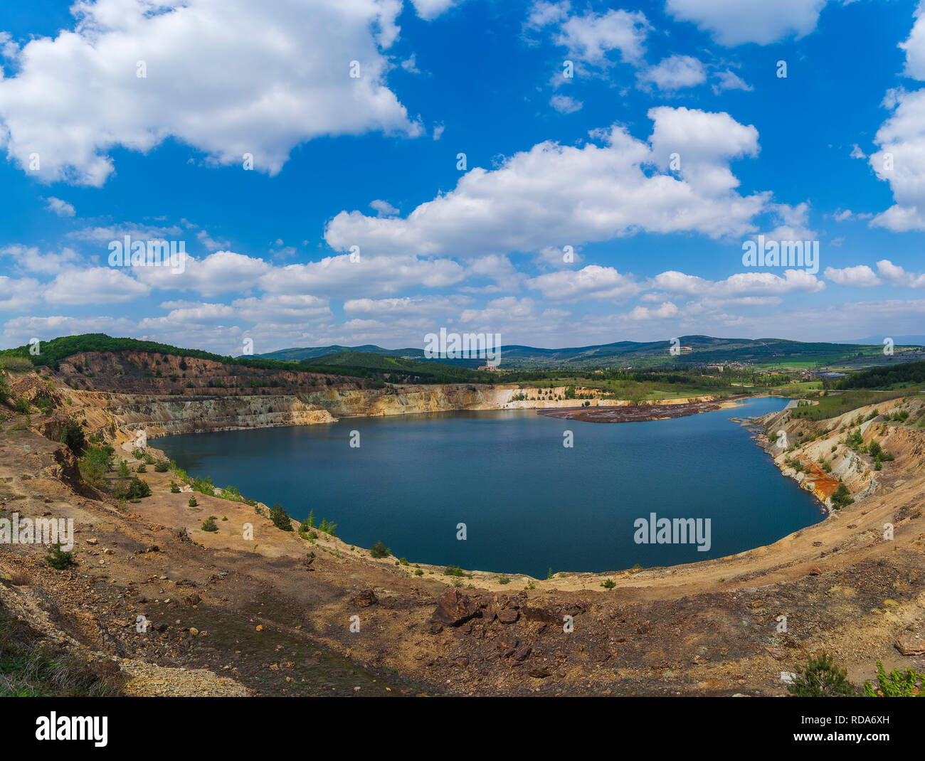 Abandoned cuprum mine in Bulgaria with lake inside Stock Photo - Alamy