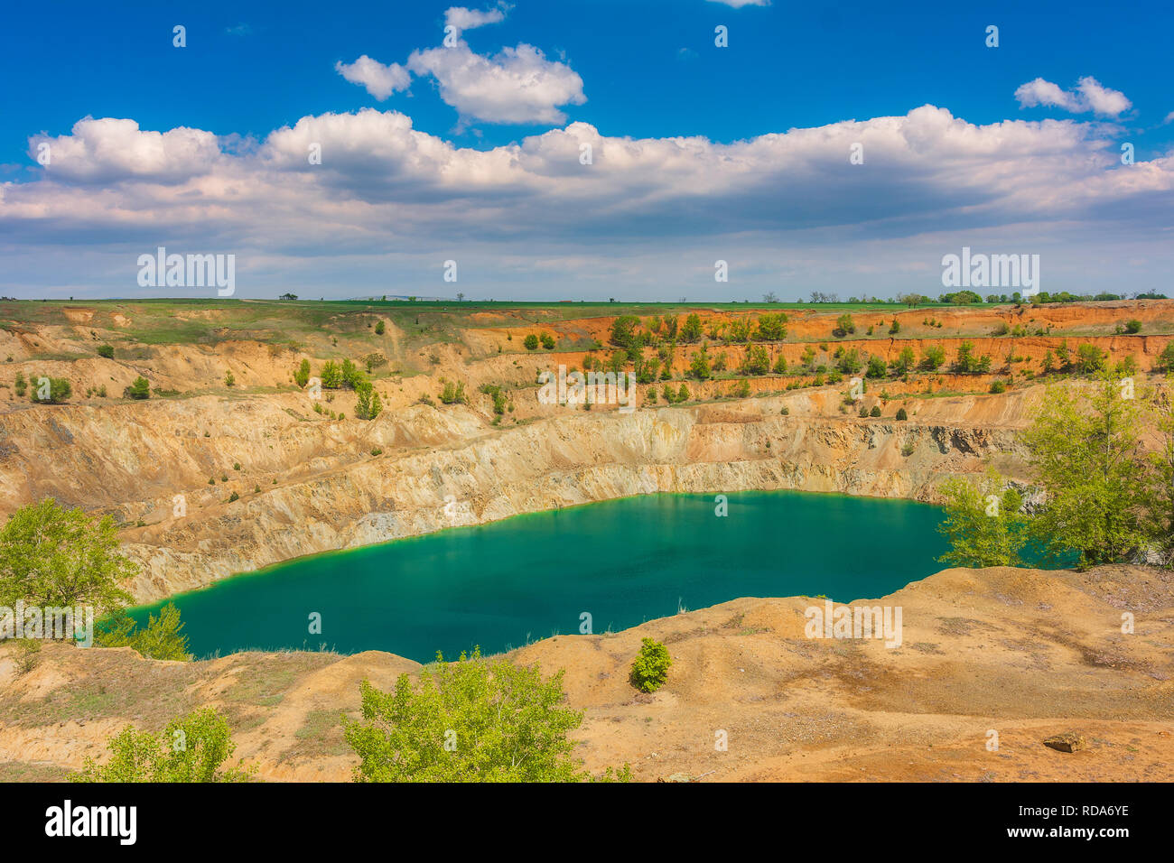 Abandoned cuprum mine in Bulgaria with lake inside Stock Photo - Alamy