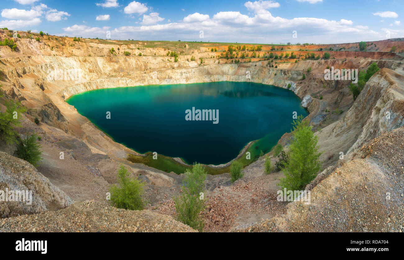 Abandoned cuprum mine in Bulgaria with lake inside Stock Photo - Alamy