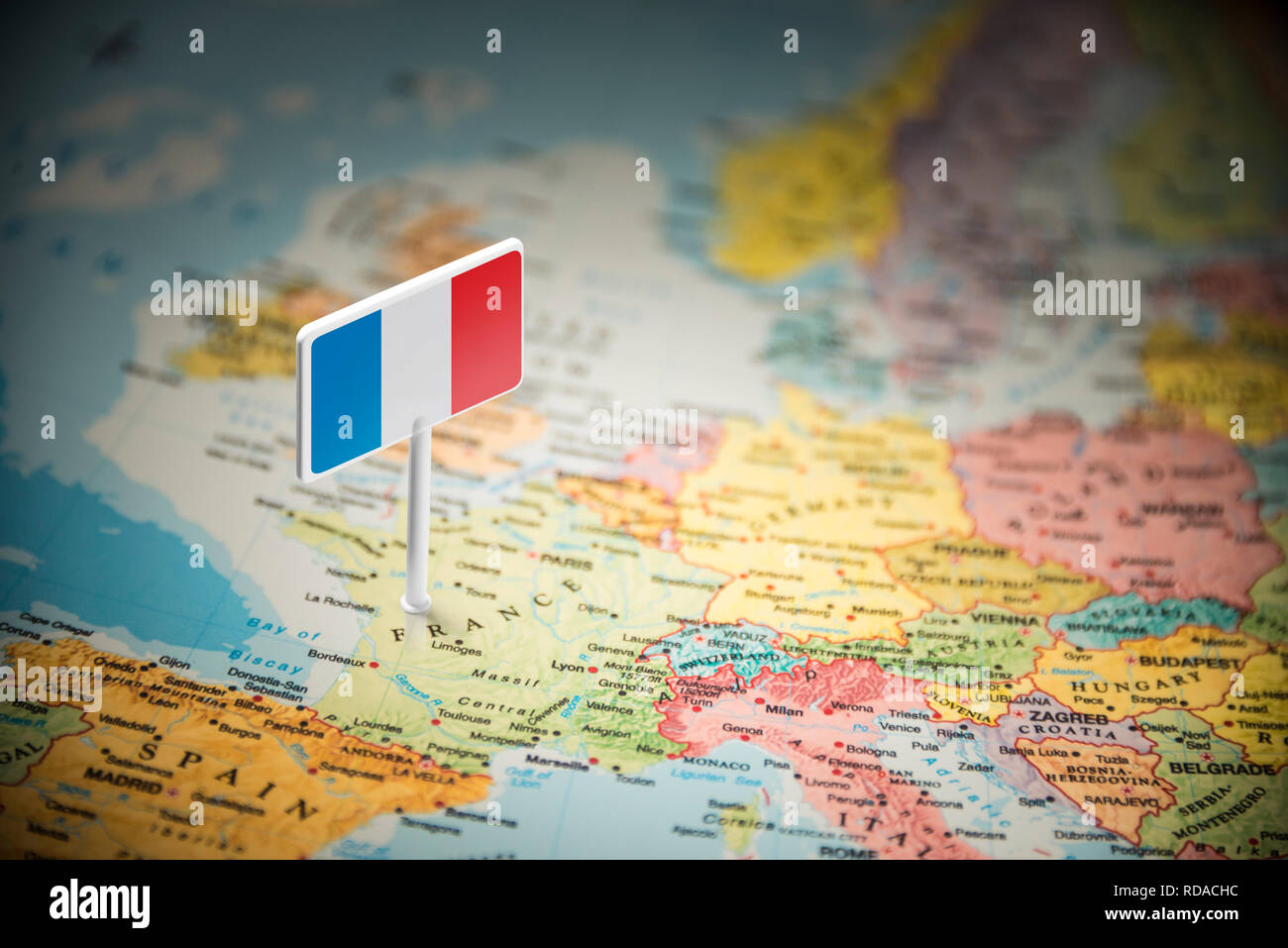 France marked with a flag on the map Stock Photo - Alamy