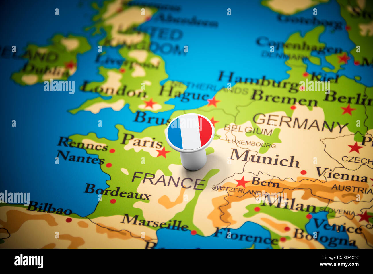 France marked with a flag on the map Stock Photo - Alamy