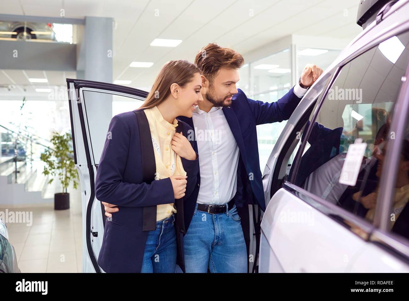 Young couple chooses car auto hi-res stock photography and images - Alamy