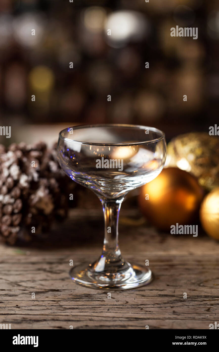empty cocktail glass on the bar, New Year's mood. in the background New ...