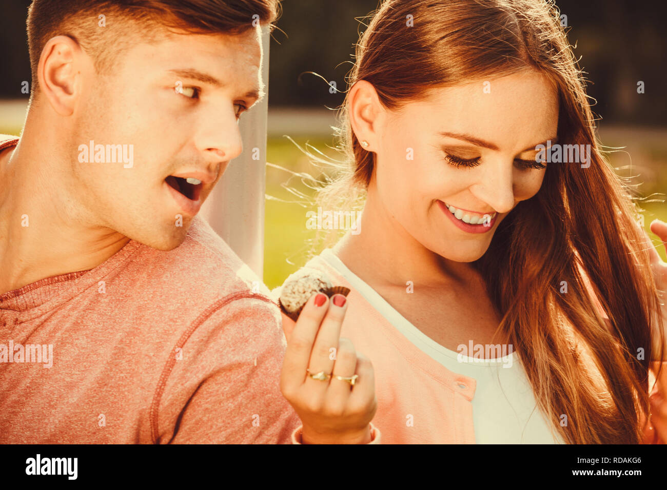 Love and dating. Young handsome man flirting with attractive woman by ...