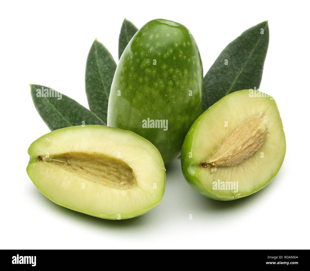 Half and whole green olives with leaves isolated on white background ...