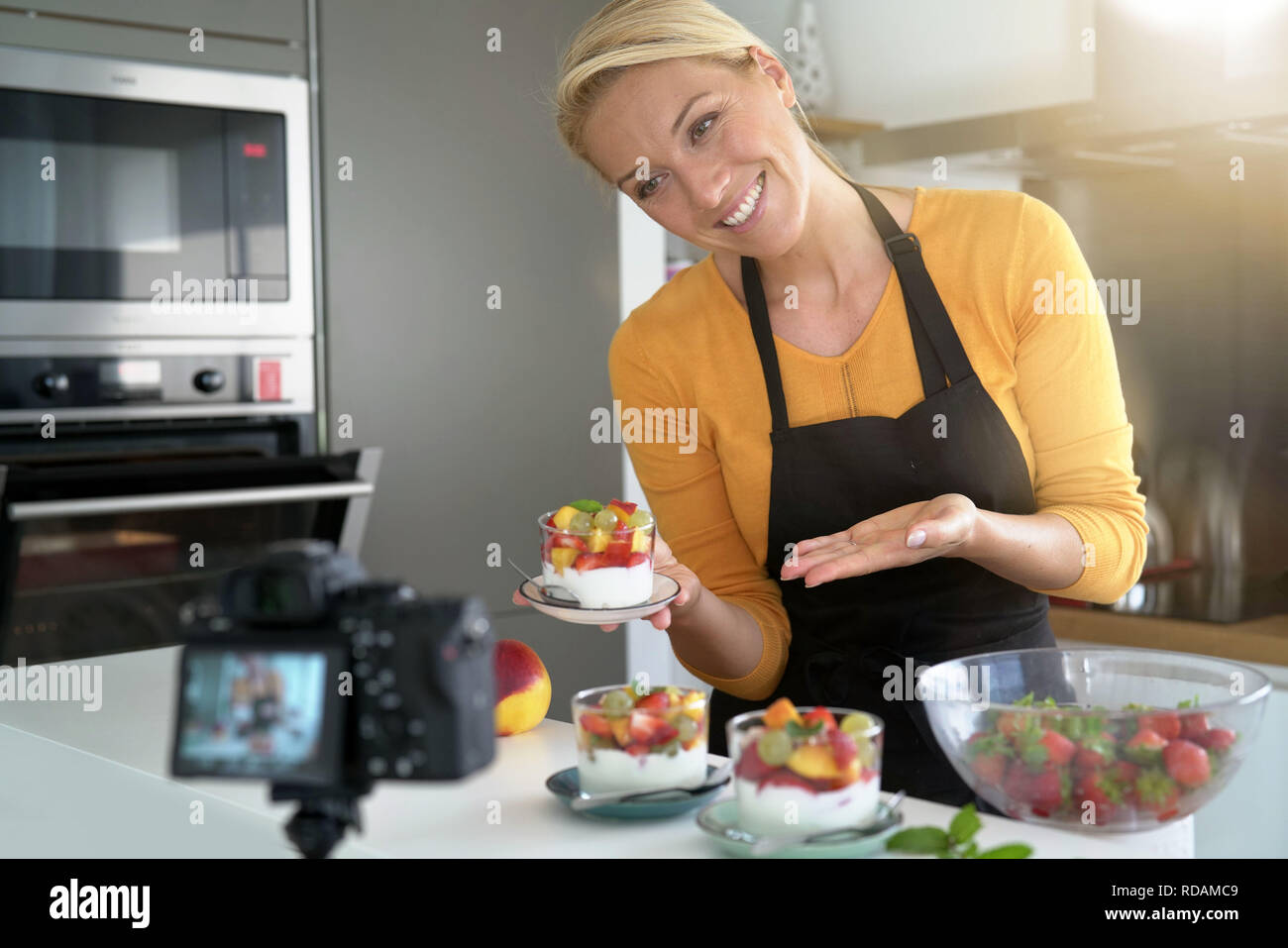 Home chef woman cooking for culinary blog Stock Photo - Alamy