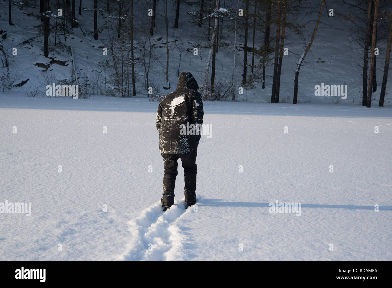 A man walking in the snow Stock Photo - Alamy