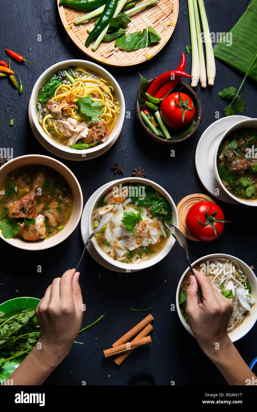 hand indulding on various malay foods Stock Photo - Alamy