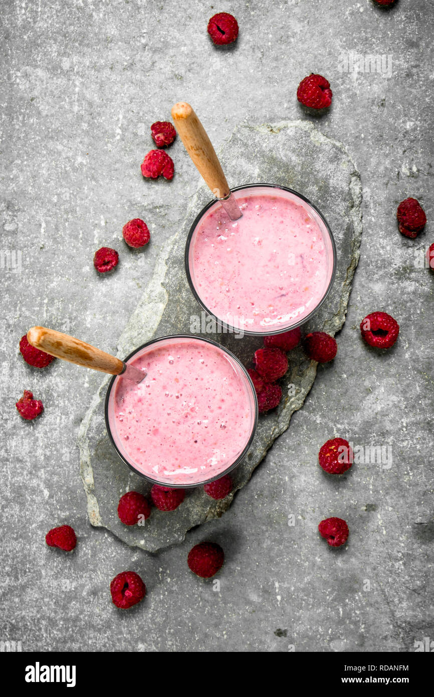 Raspberry milk smoothie. On rustic background Stock Photo - Alamy