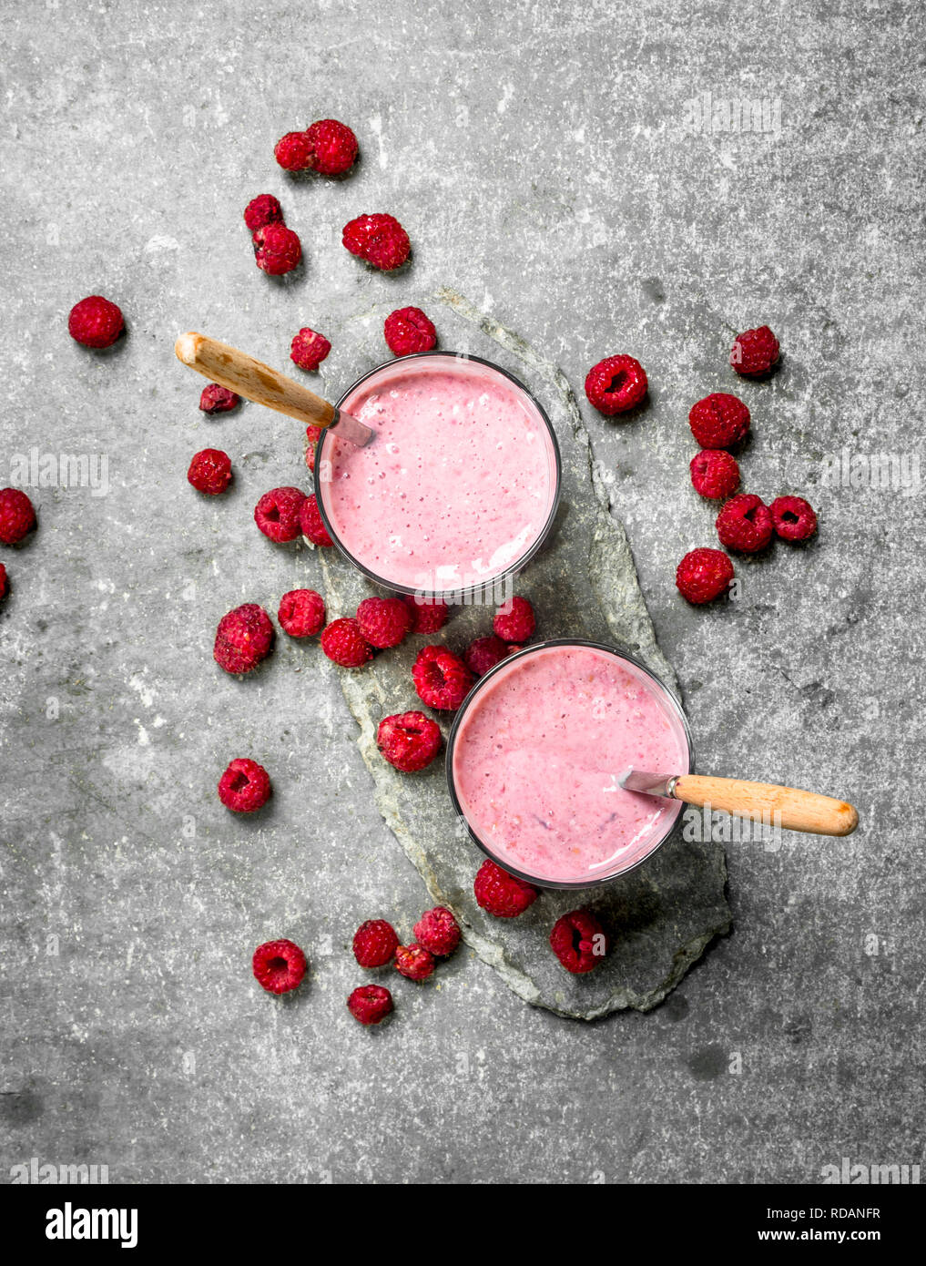 Raspberry milk smoothie. On rustic background Stock Photo - Alamy