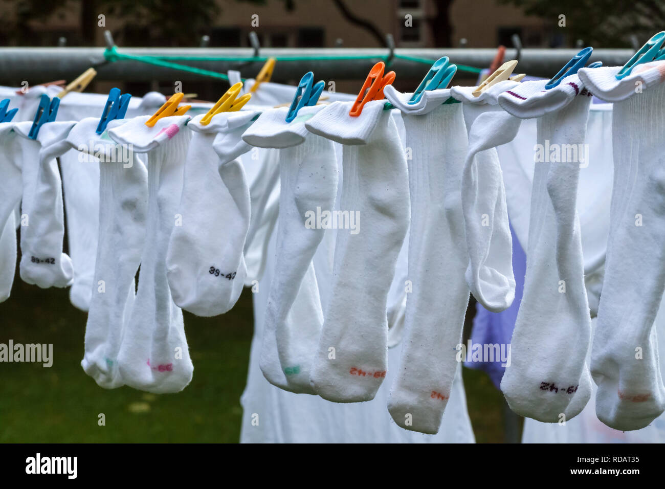 Washing line with baby clothing hi-res stock photography and images - Alamy