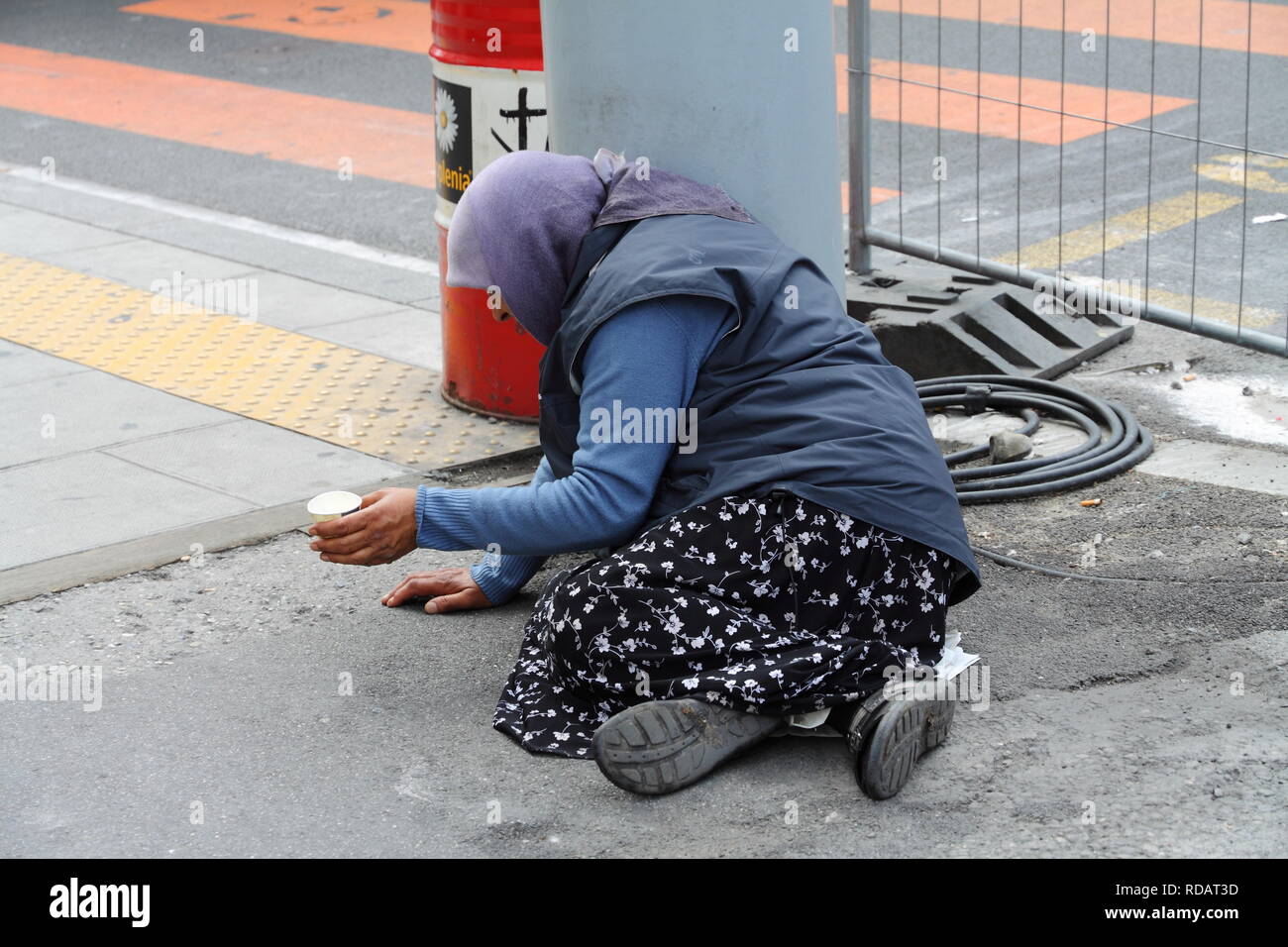 Man begging cup hi-res stock photography and images - Alamy