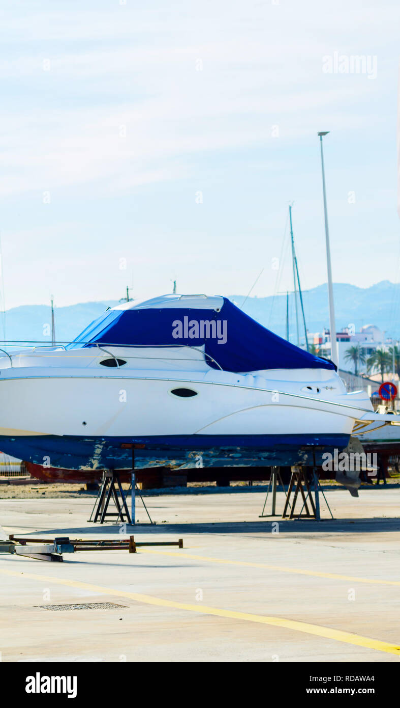 Boat on stand on the shore, close up on the part of the yacht, luxury ...